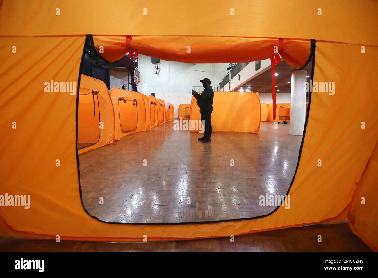 A government official inspect isolation tents that will serve as a ...