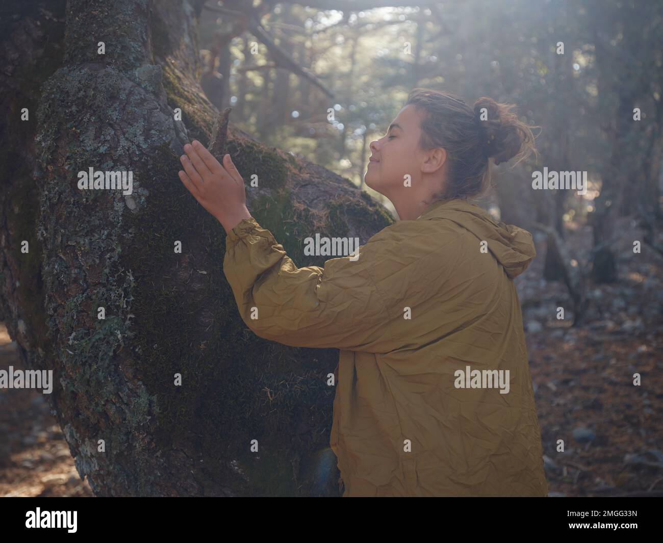 caucasian woman enjoys being in nature, beautiful forest in mountains ...