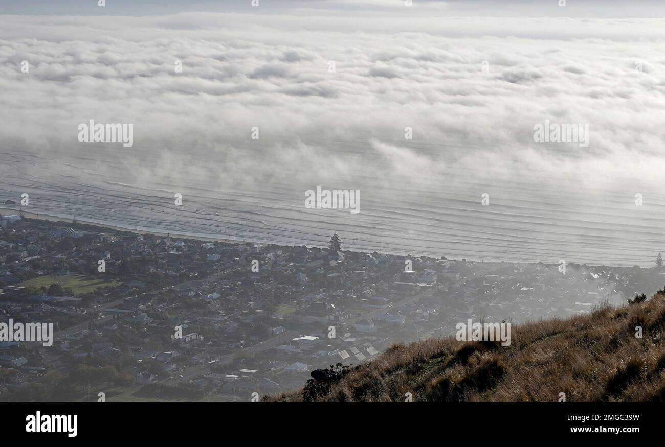 A heavy blanket of cloud hangs over Sumner Beach near Christchurch, New ...