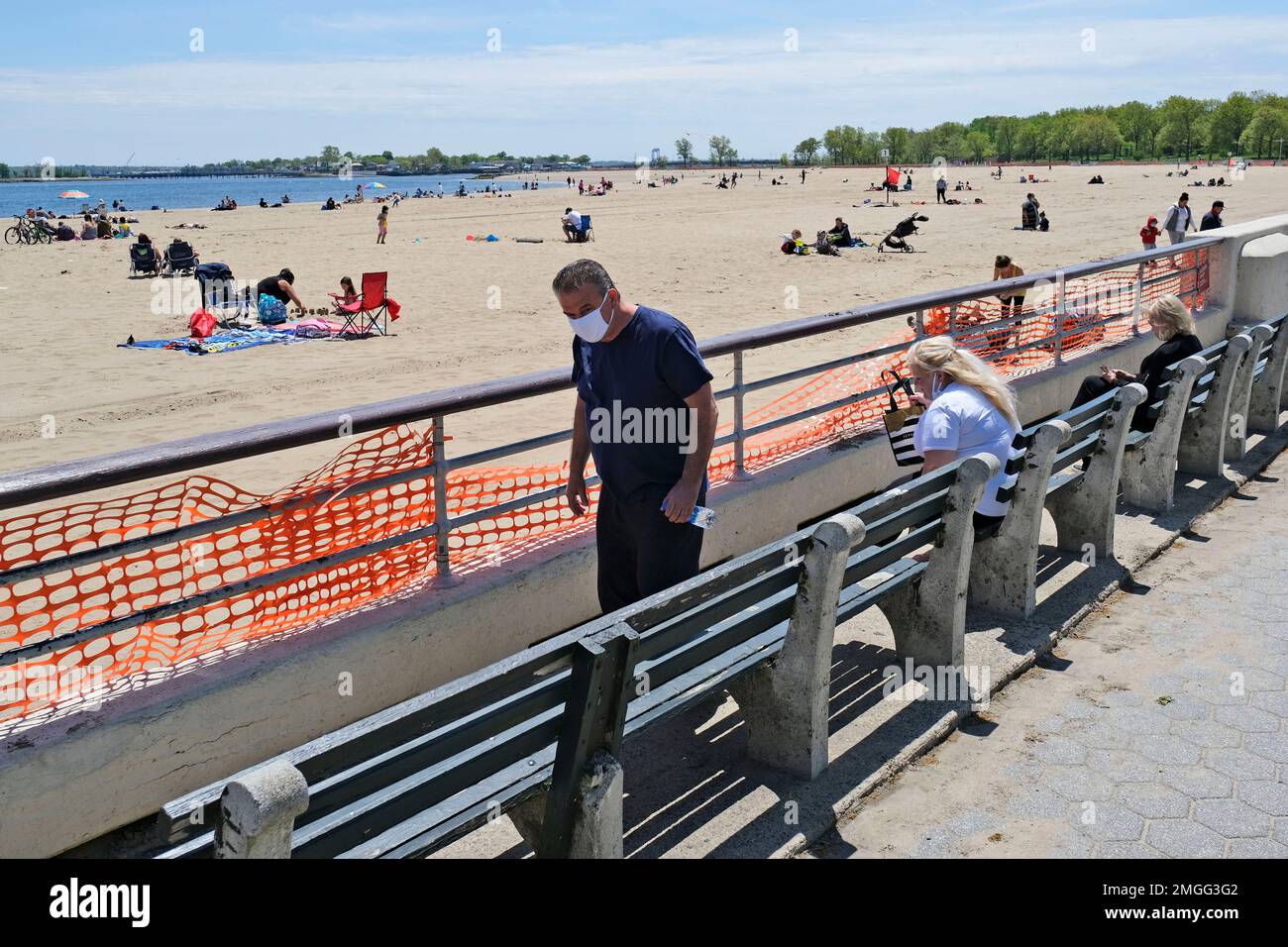 People get some fresh air at Orchard Beach in the Bronx borough of New ...