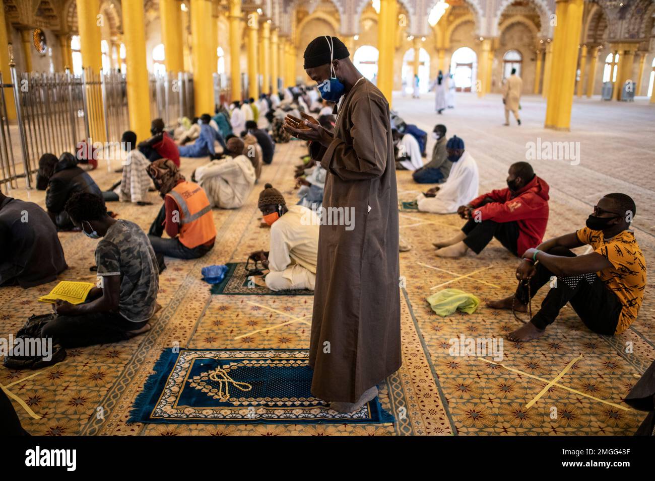 In this photo taken Friday, May 15, 2020, a follower of the Senegalese ...