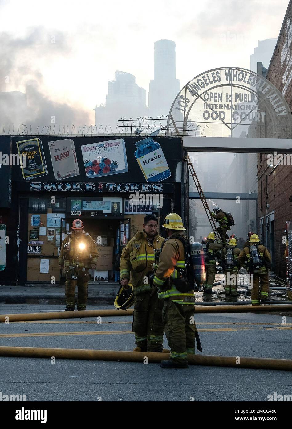 Los Angeles Fire Department firefighters work the scene of a structure ...
