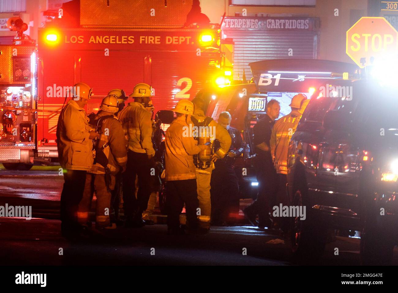 Los Angeles Fire Department firefighters work the scene of a structure ...