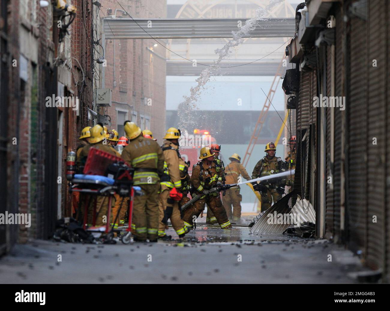 Los Angeles Fire Department firefighters work the scene of a structure ...