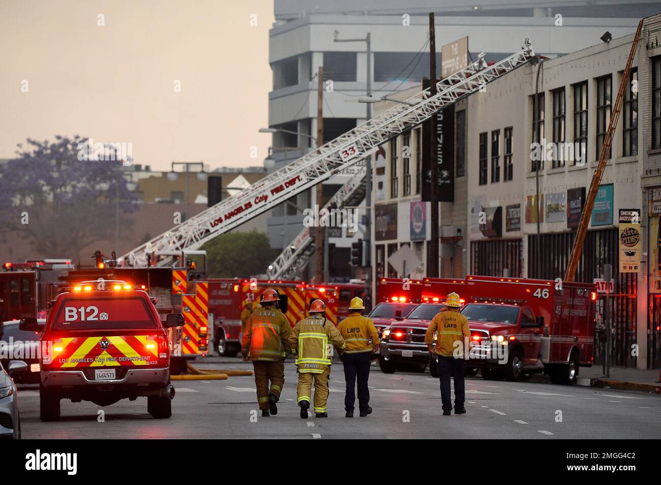 Los Angeles Fire Department firefighters work the scene of a structure ...