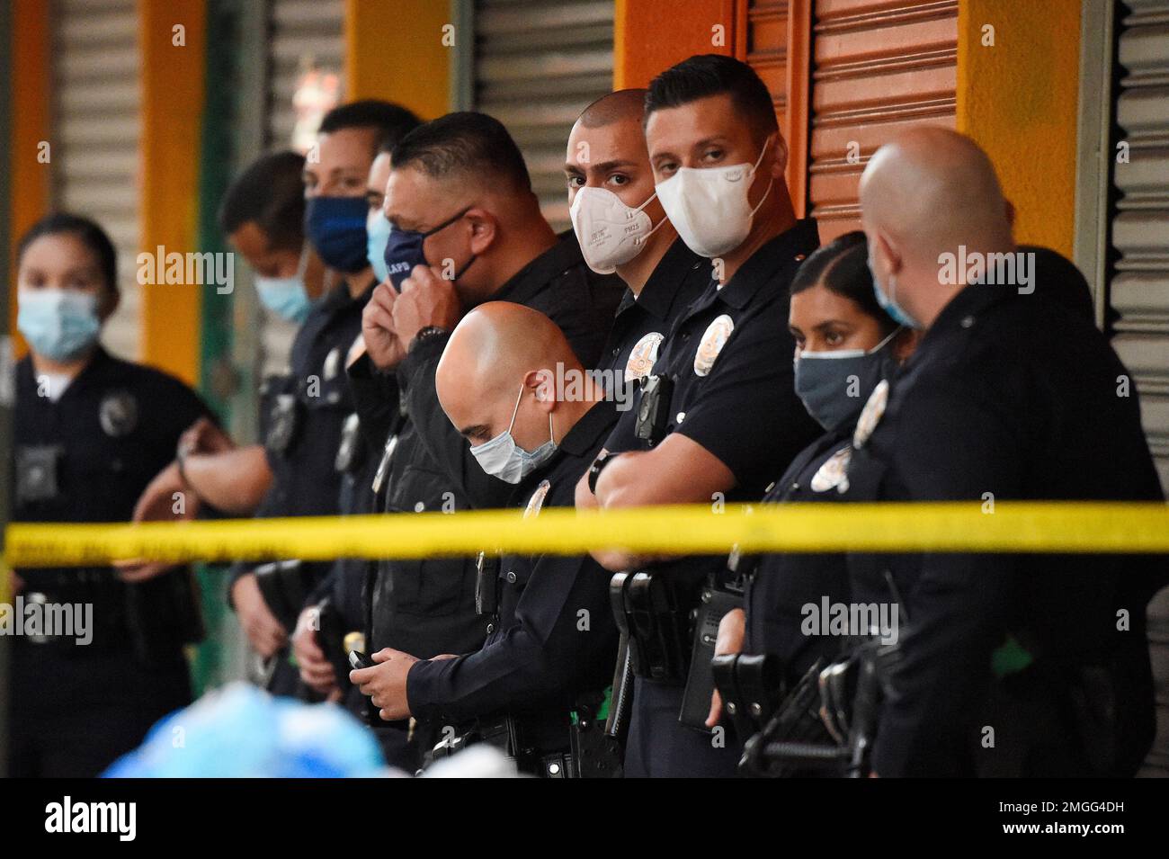 Los Angeles Police Department officers stand at the scene of a ...