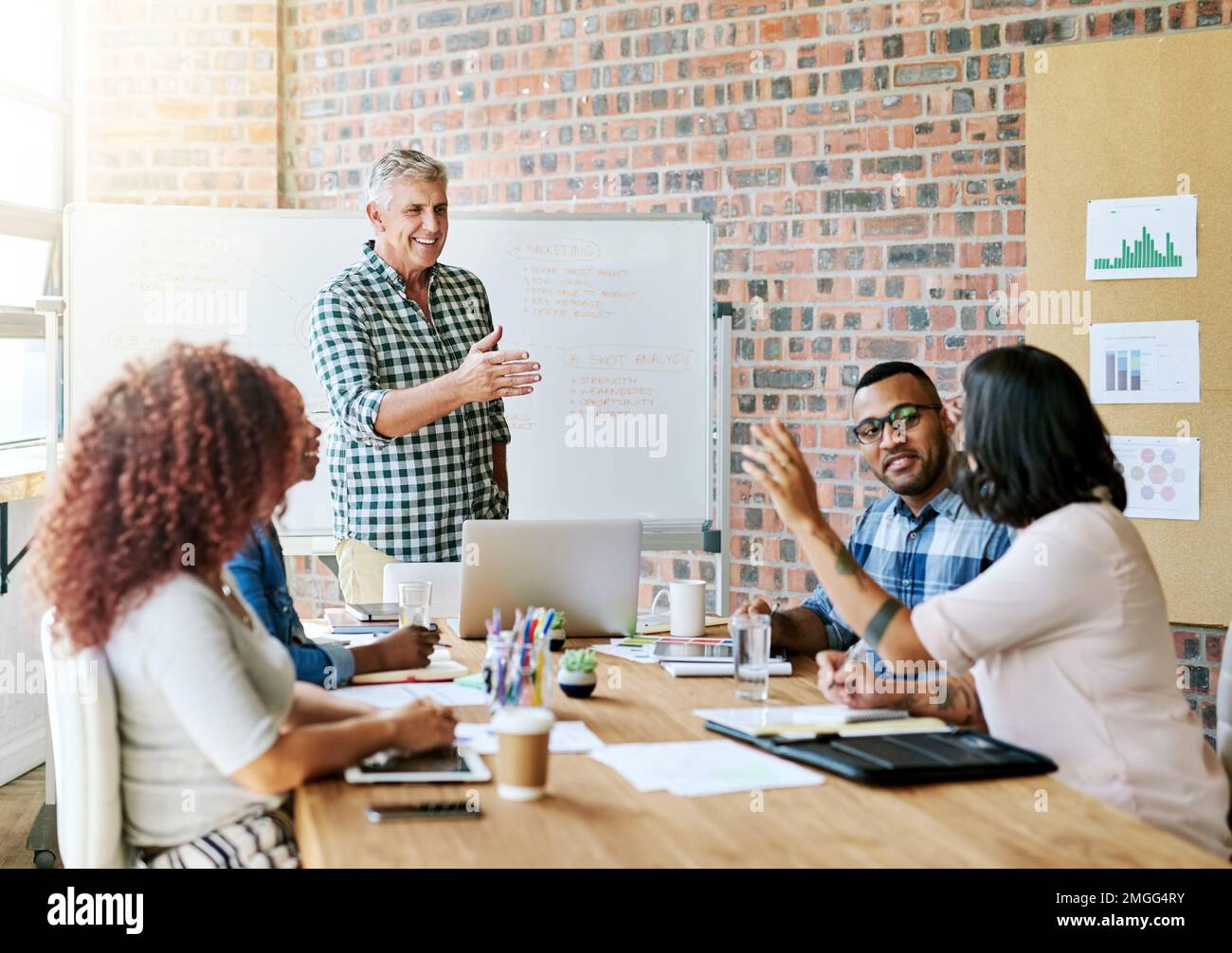 Steering their way to a successful course. a businessman giving a ...