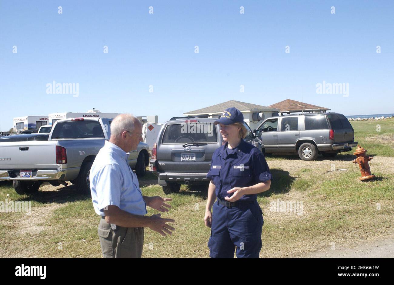 Coast Guard Auxiliary - 26-HK-64-11. Coast Guard woman and civilian in ...