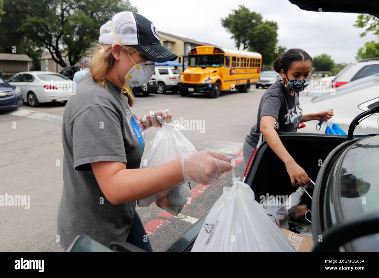Emily Dragoo, left, a teacher at Apollo Jr. High helps a Richardson ...