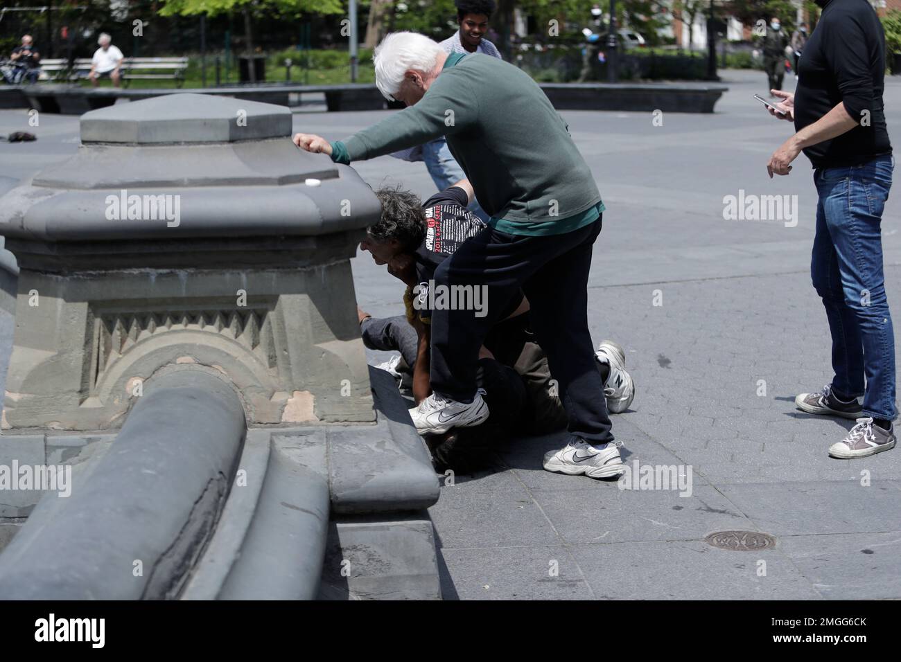 A man joins a fight between two men in Washington Square Park Friday ...