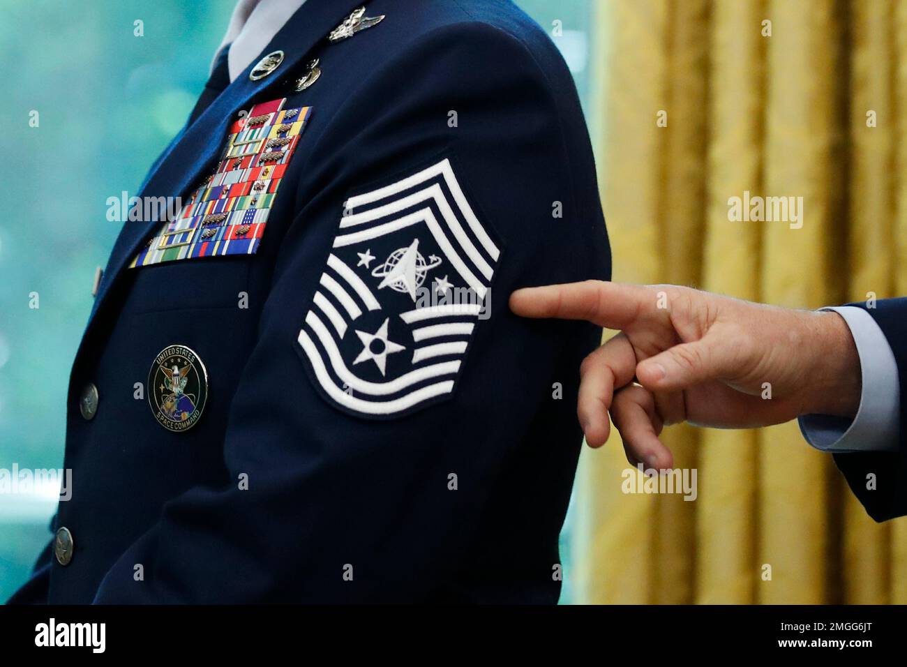 Chief Master Sgt. Roger Towberman displays his insignia during a ...