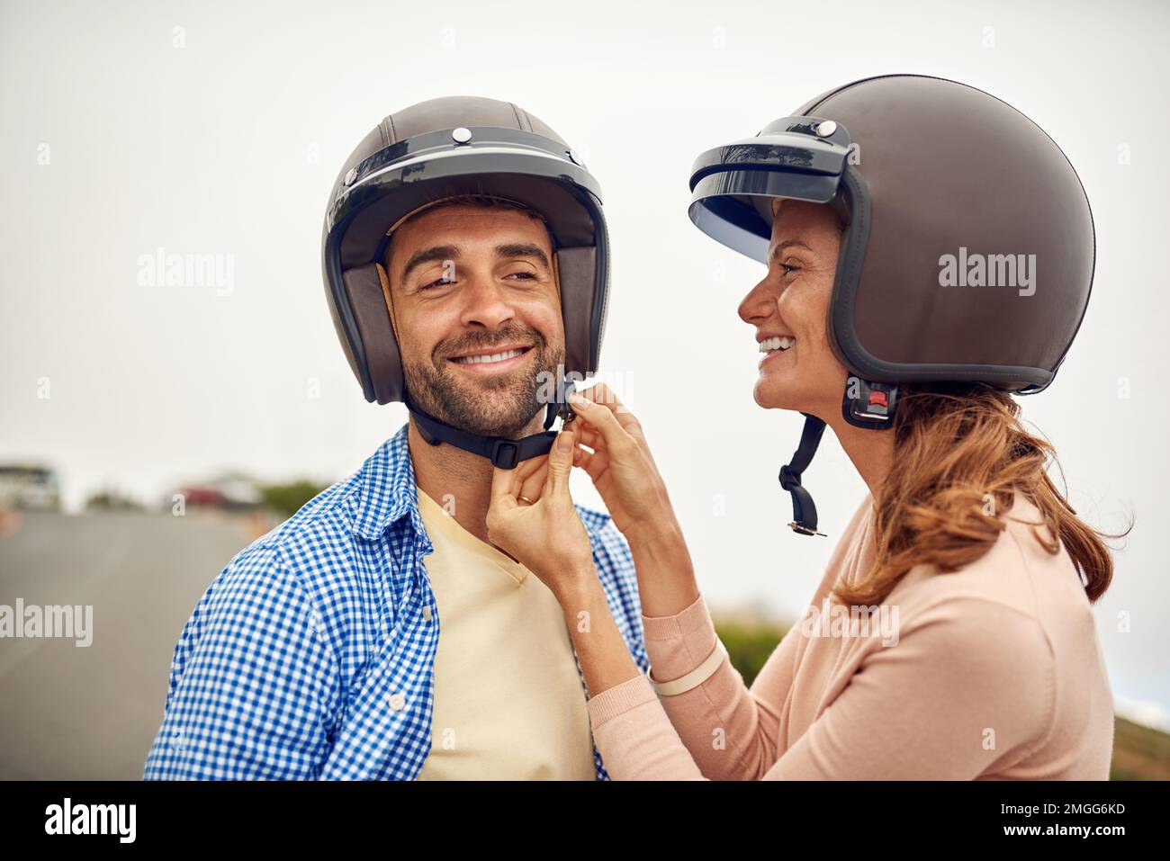 The fun begins when the helmet goes on. a woman adjusting her ...
