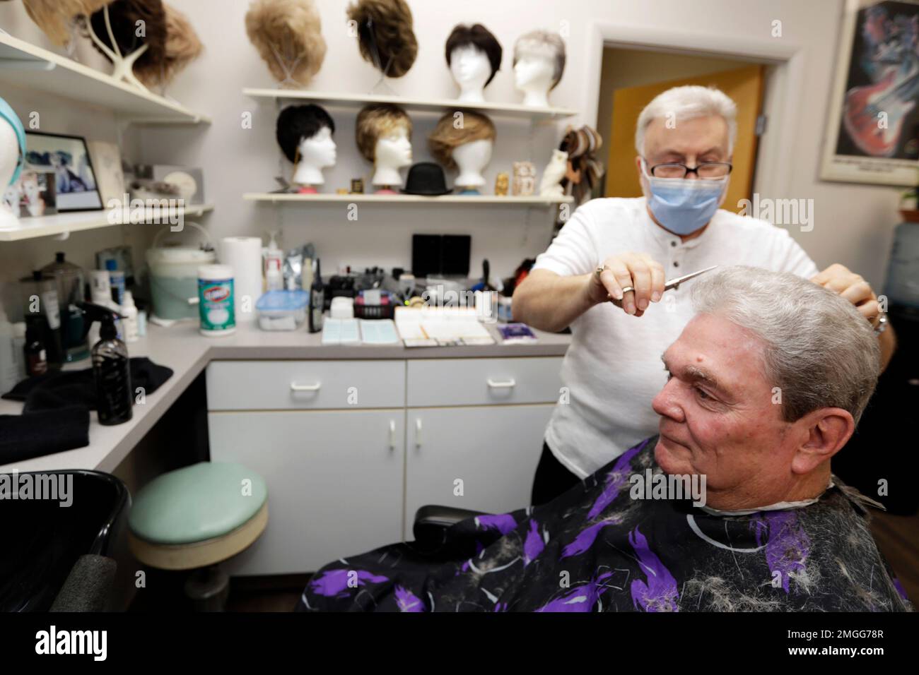 Robert Secrest gets a haircut from Bill Conti at Hair Care Designers ...