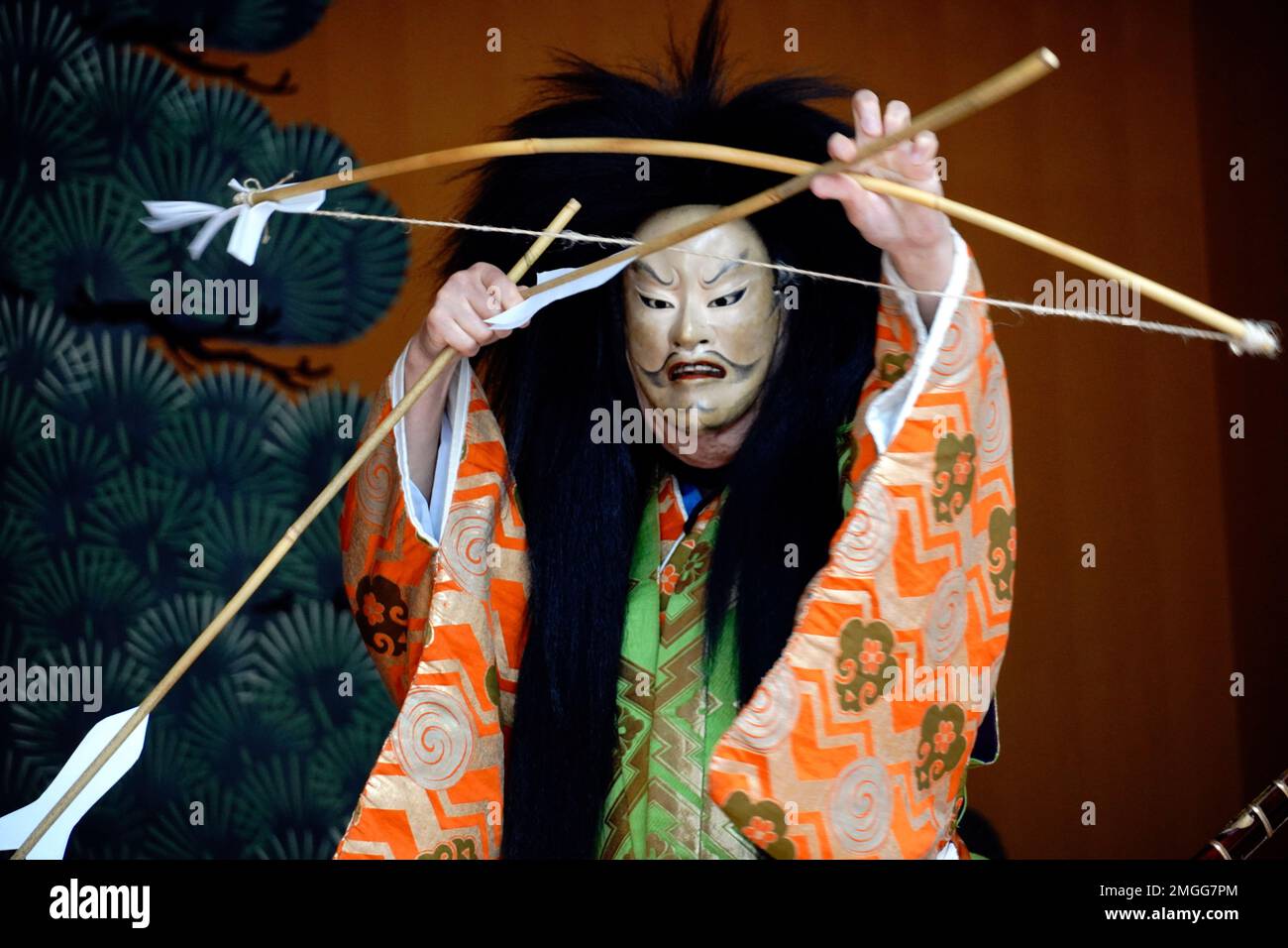 An artist wearing a Japanese traditional mask performs to Shinto music ...