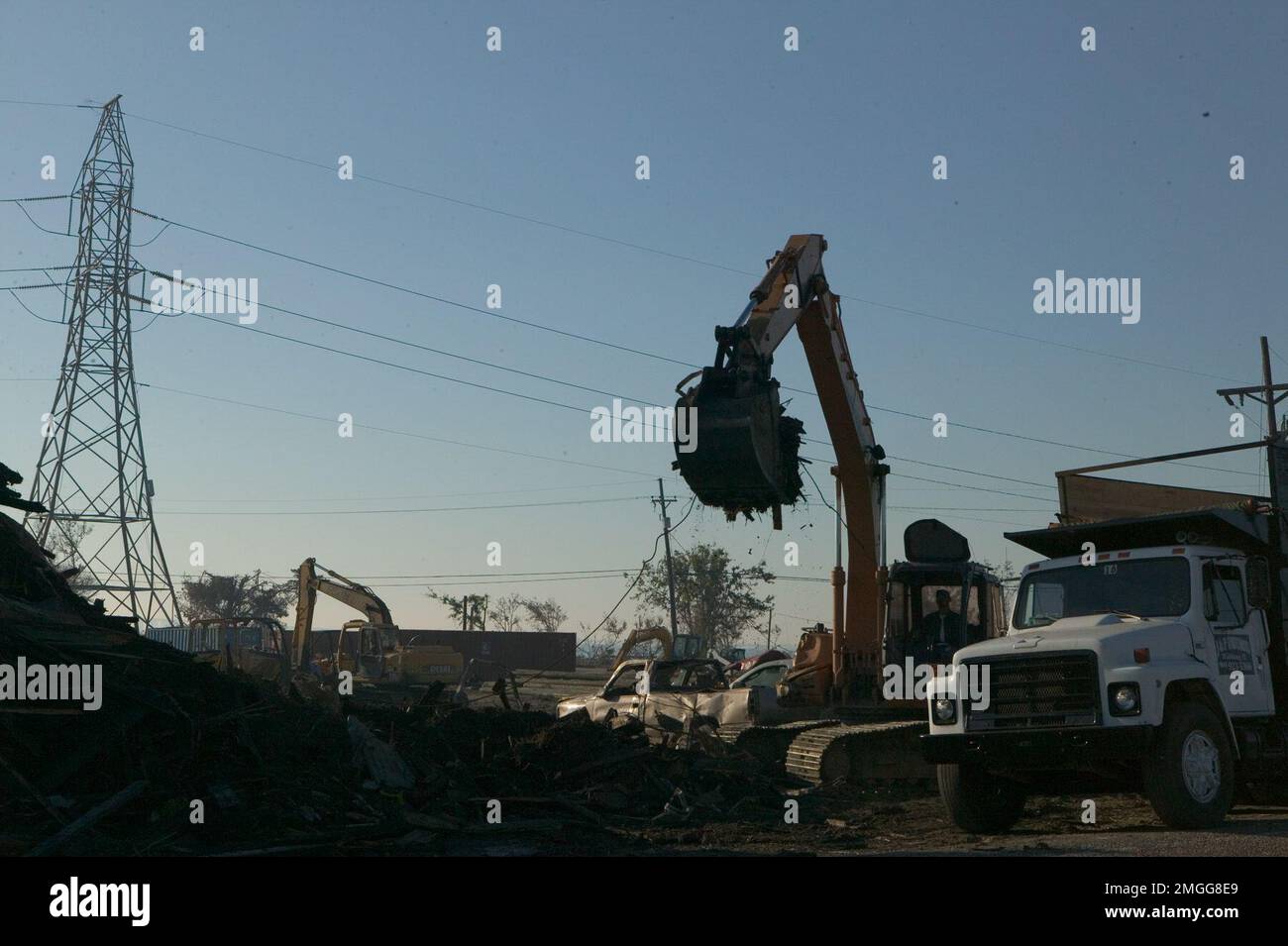 Aftermath - Debris - 26-HK-31-14. Slidell debris--crane filling trucks ...
