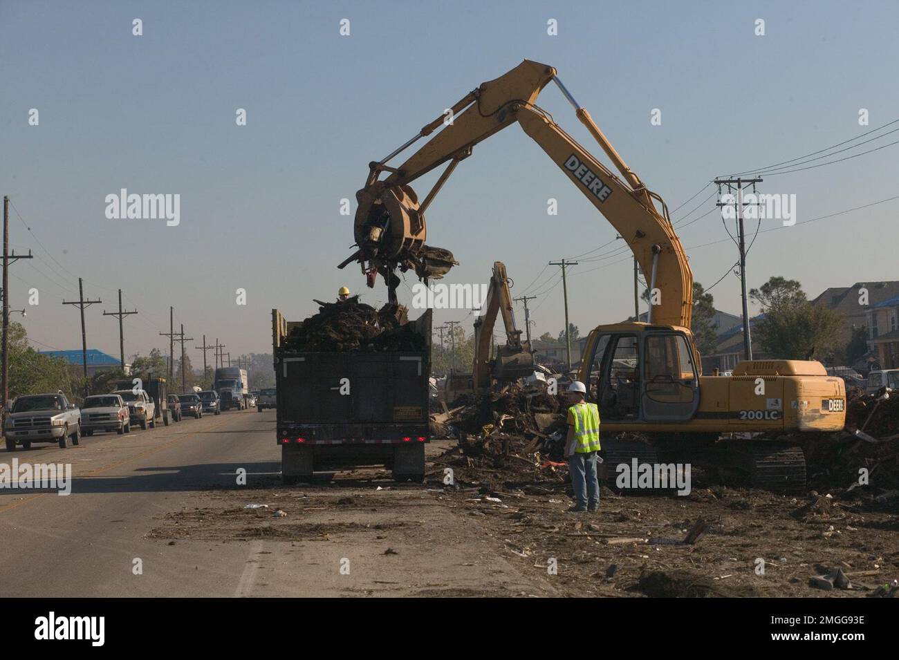 Aftermath - Debris - 26-HK-31-13. Slidell debris--crane filling truck ...