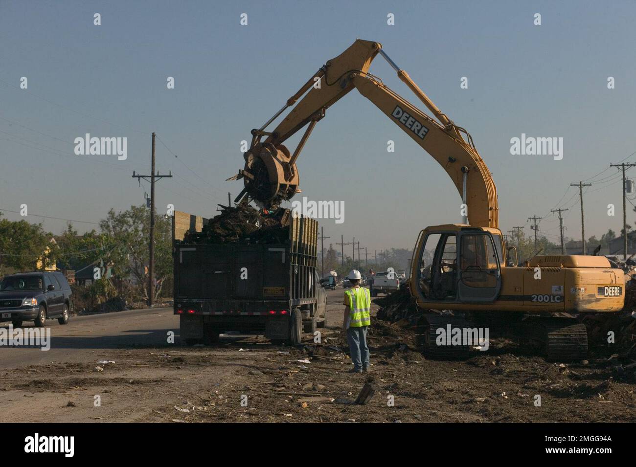 Aftermath - Debris - 26-HK-31-12. Slidell debris--crane filling truck ...