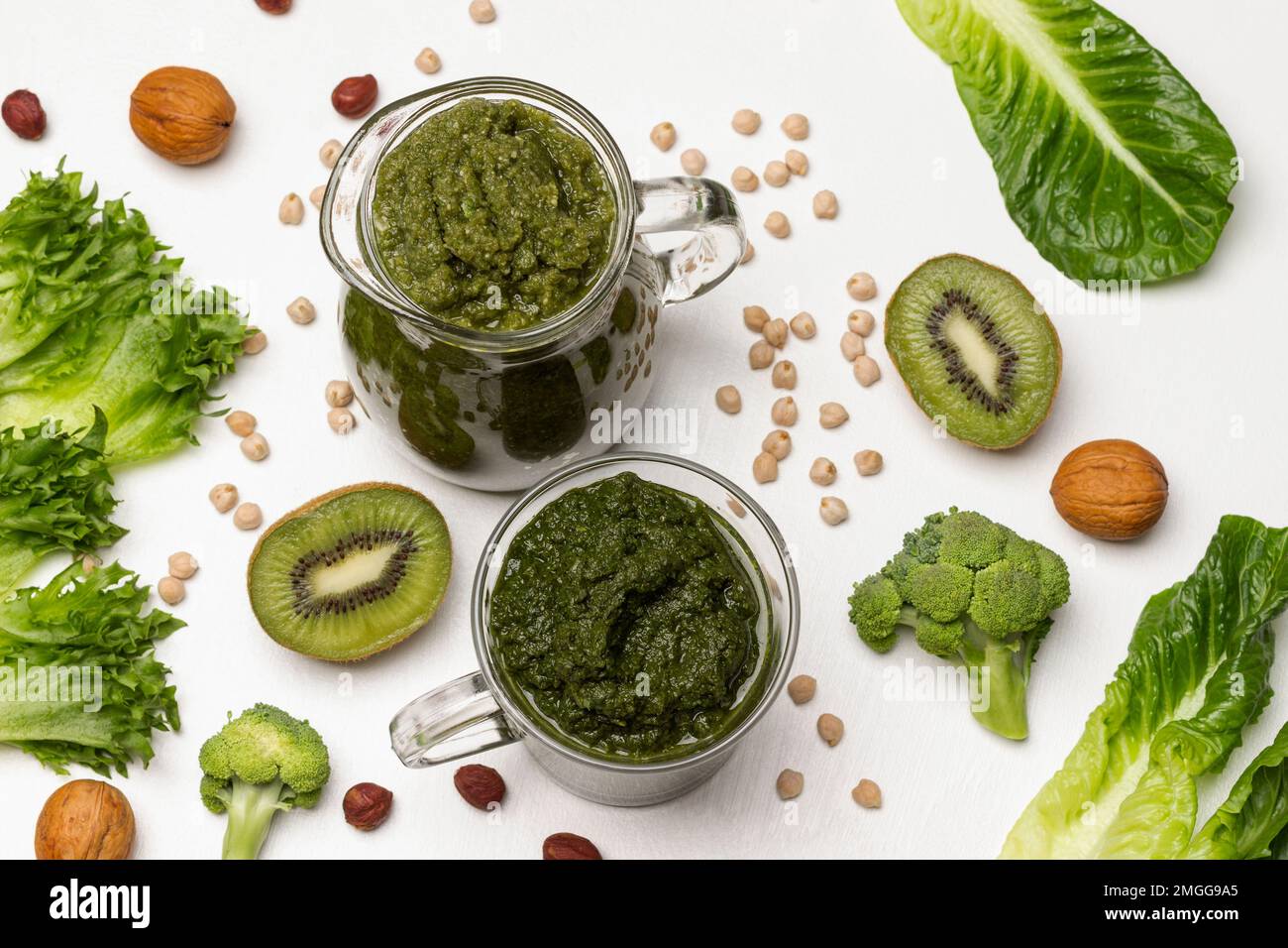 Glass jug and mug with mixed vegetables. Chickpeas, lettuce and ...
