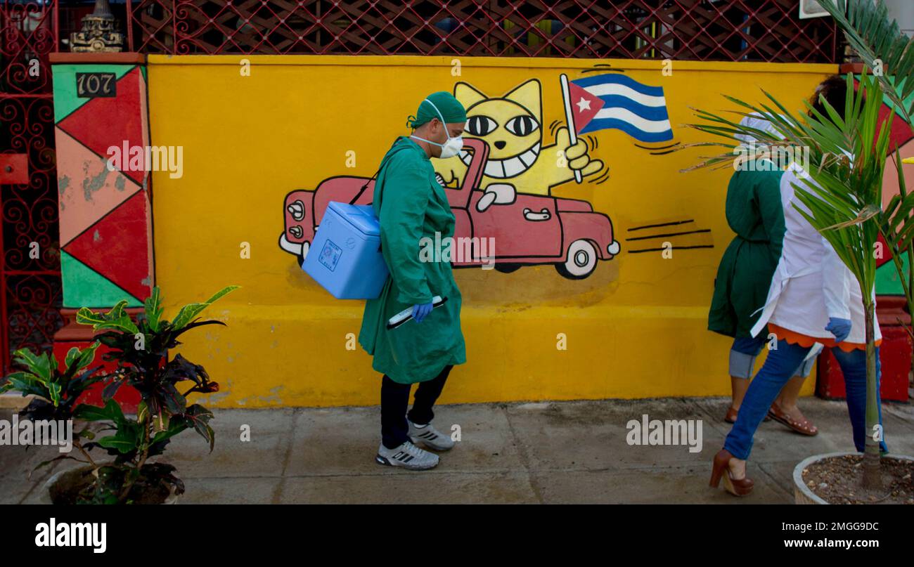 Lab technician Alfredo Flores walks from home to home to collect ...