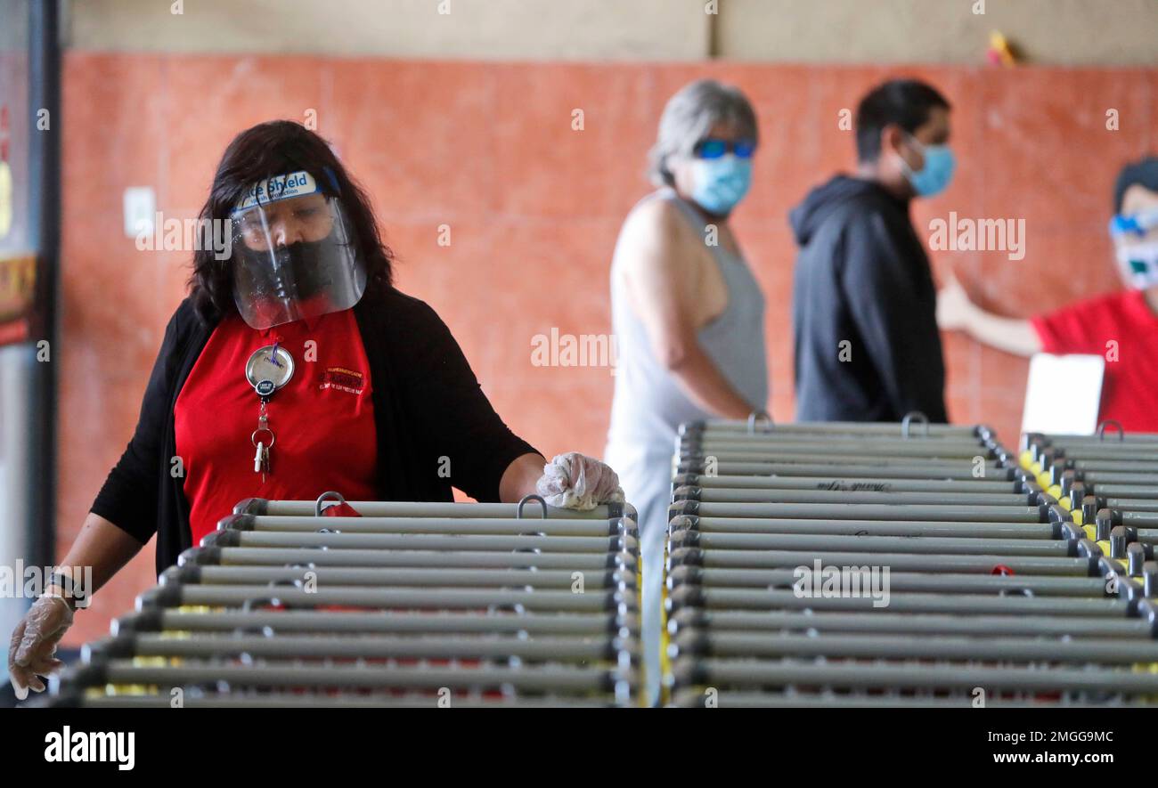 Amid concerns of the spread of COVID-19, Dora Villarreal wipe cart ...