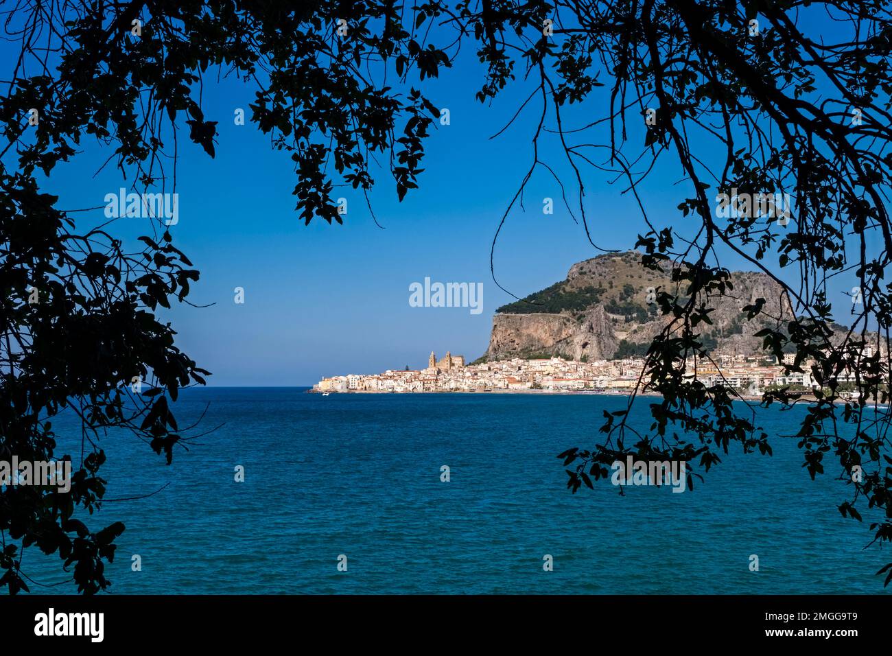 View across the sea to the medieval town of Cefalu, located on the ...