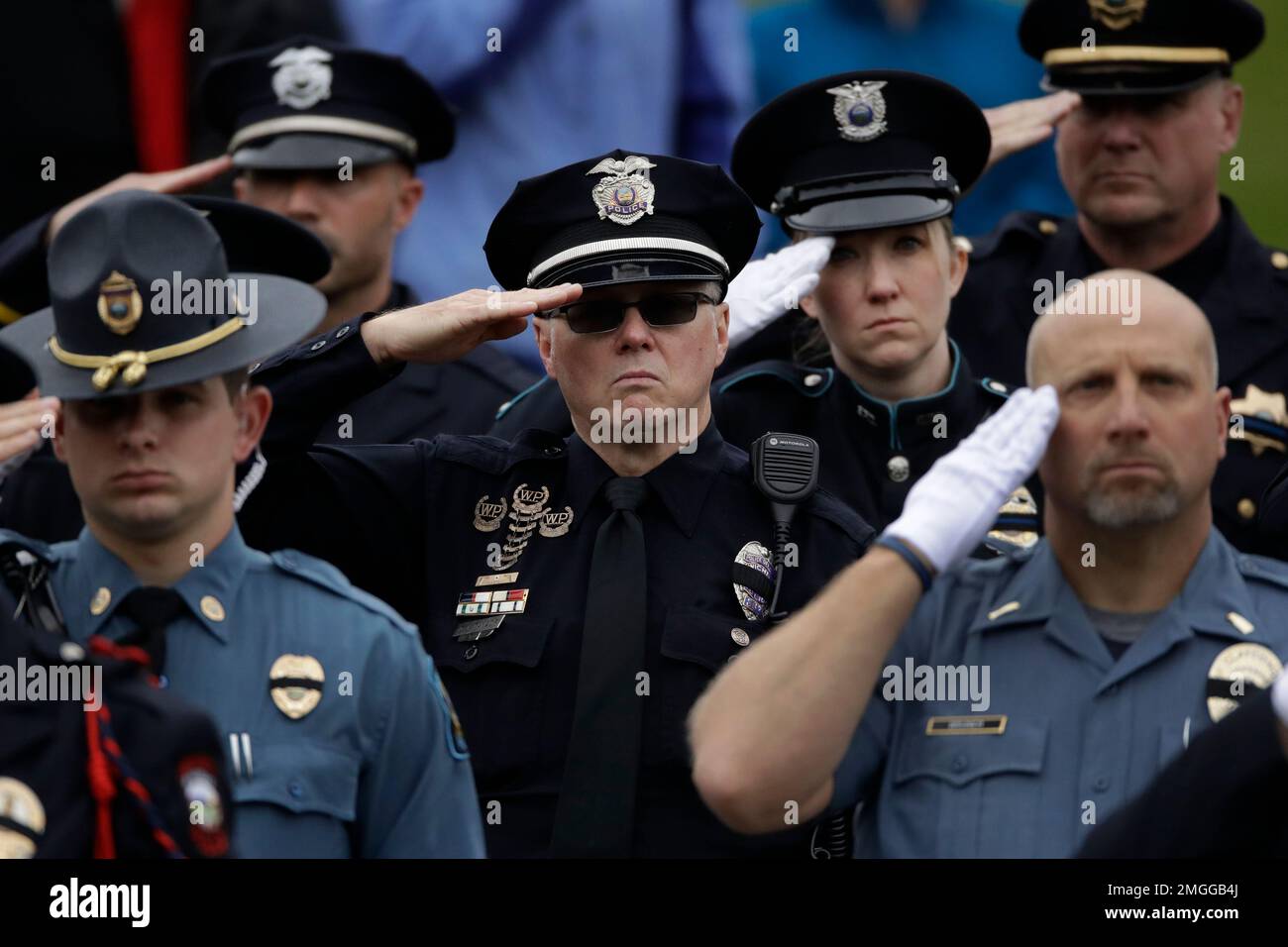 Police from a variety of different departments salute slain police ...