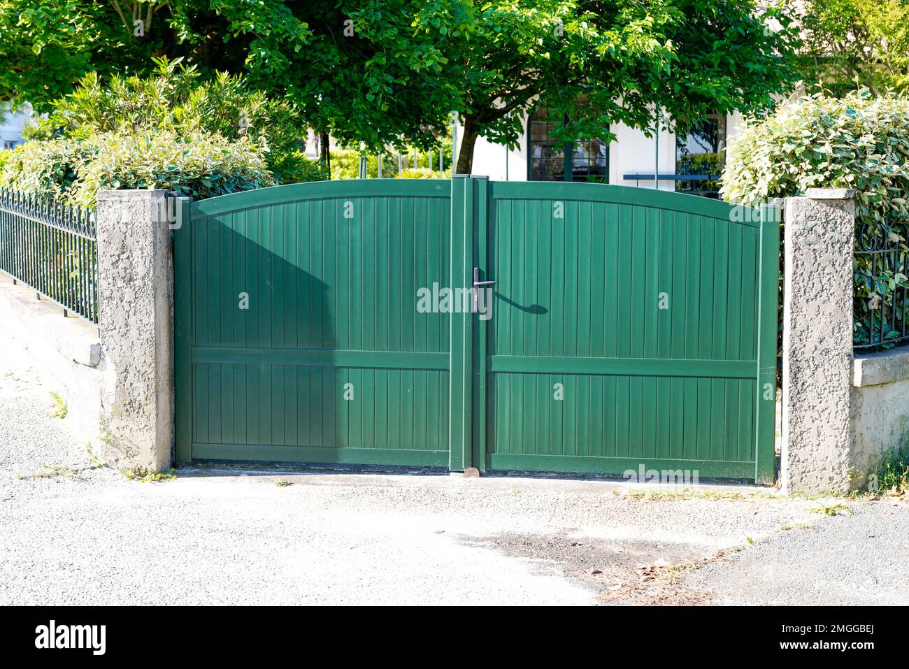 street suburb home green house gate garden access door Stock Photo - Alamy