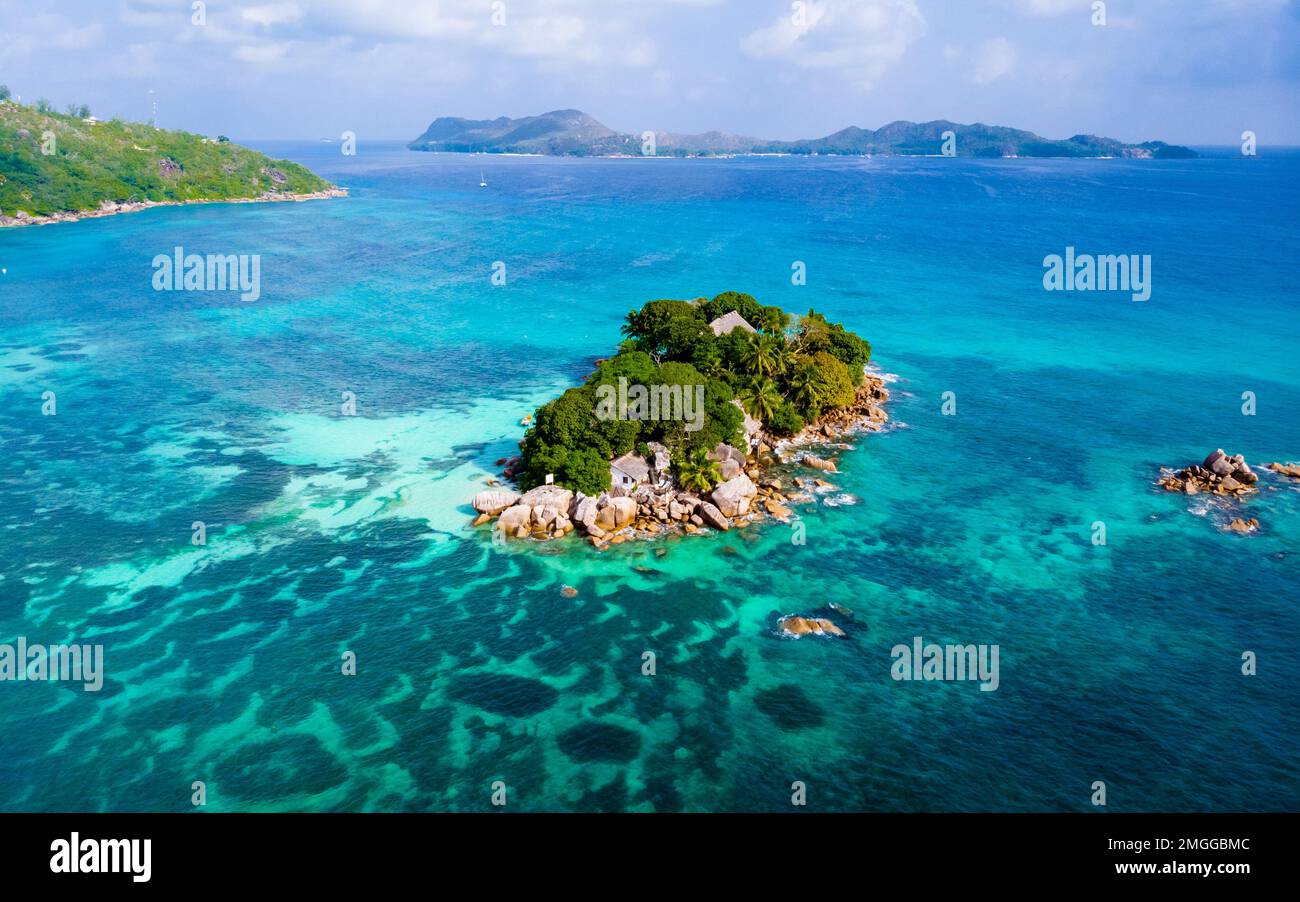 Drone view from above at a tropical beach in Seychelles. Anse Volbert ...