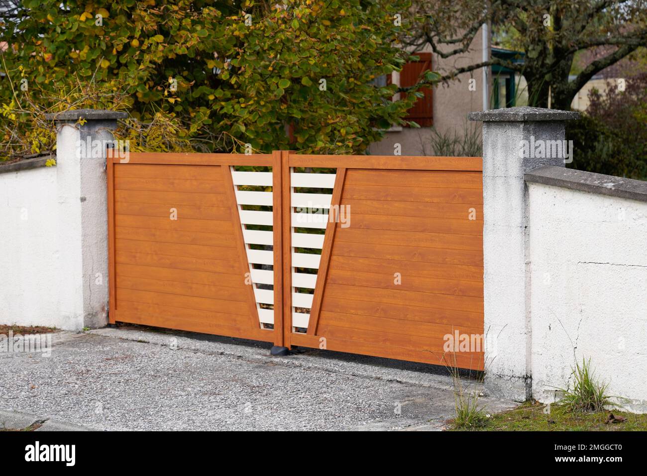 modern wooden panel fence for home and gate access garden house Stock ...
