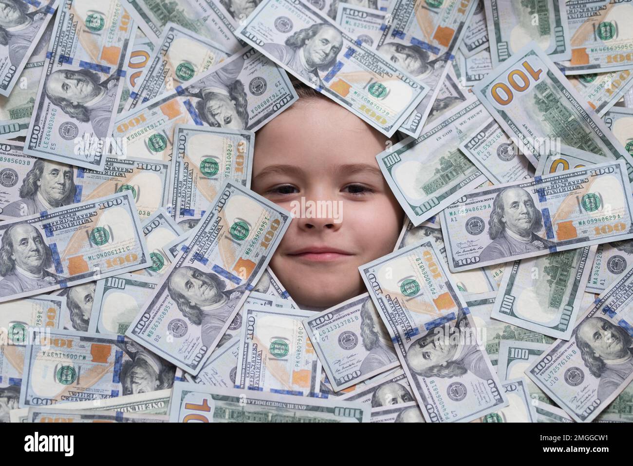 Funny face in lot of money. Fun kid face on dollars money. Money ...