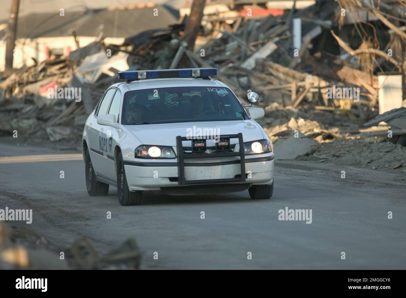 Aftermath - Parishes - 26-HK-42-40. 9th Ward Damage--police car driving ...