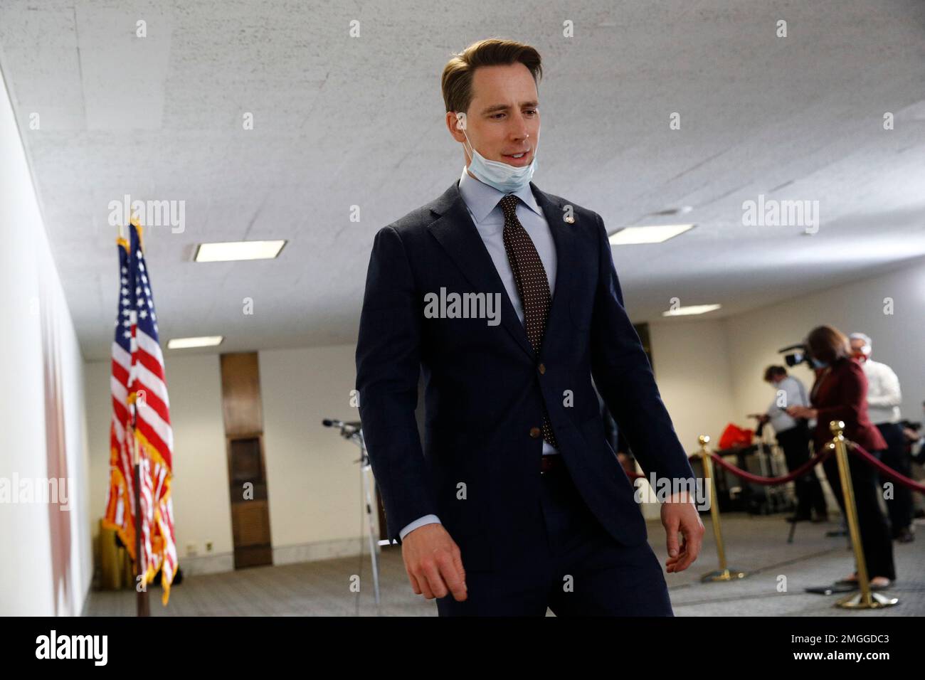 Sen. Josh Hawley, R-Miss., wears a face mask to protect against the ...
