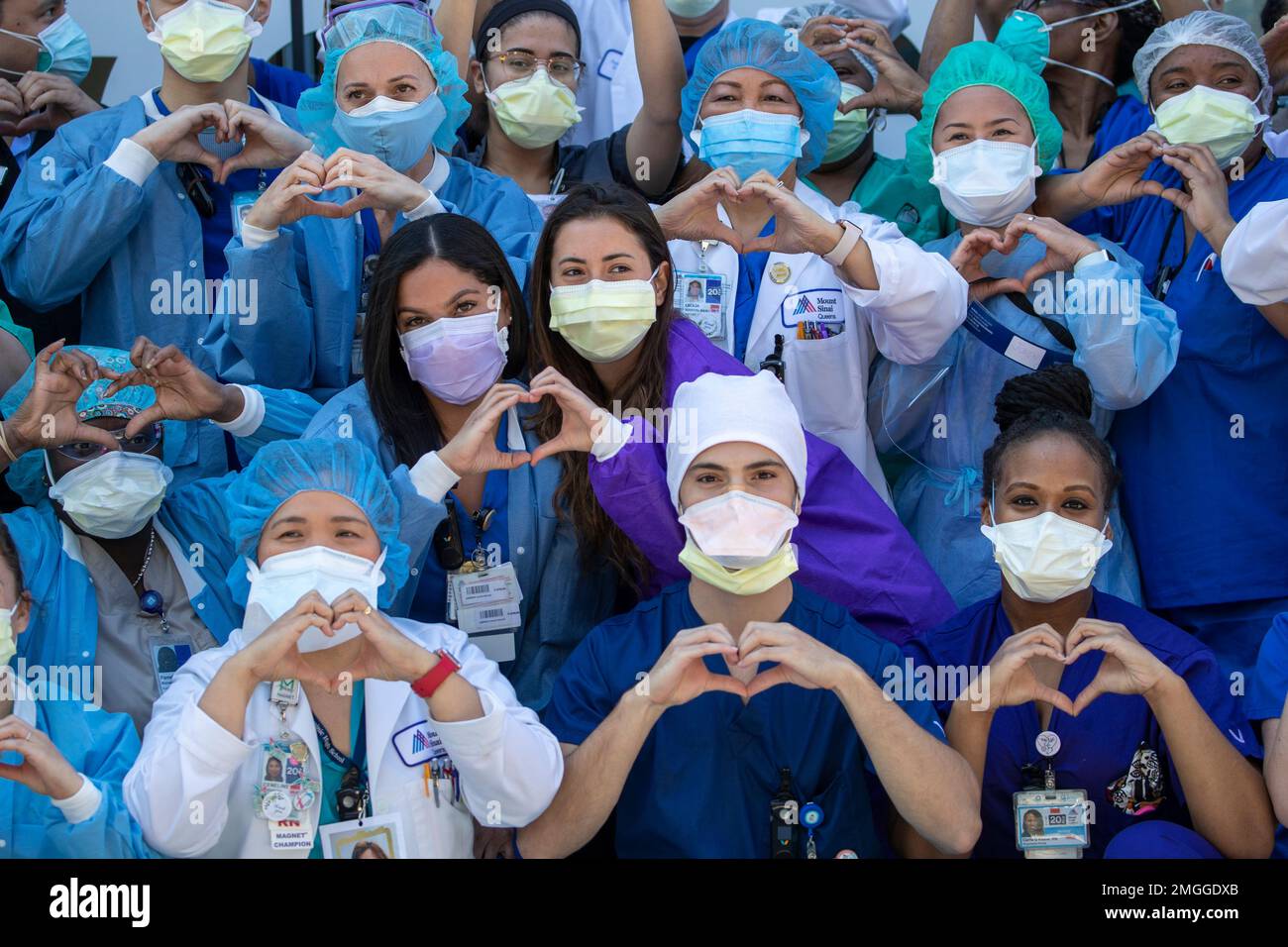 Mount Sinai Queens nurses make a heart sign as they pose for a photo to ...