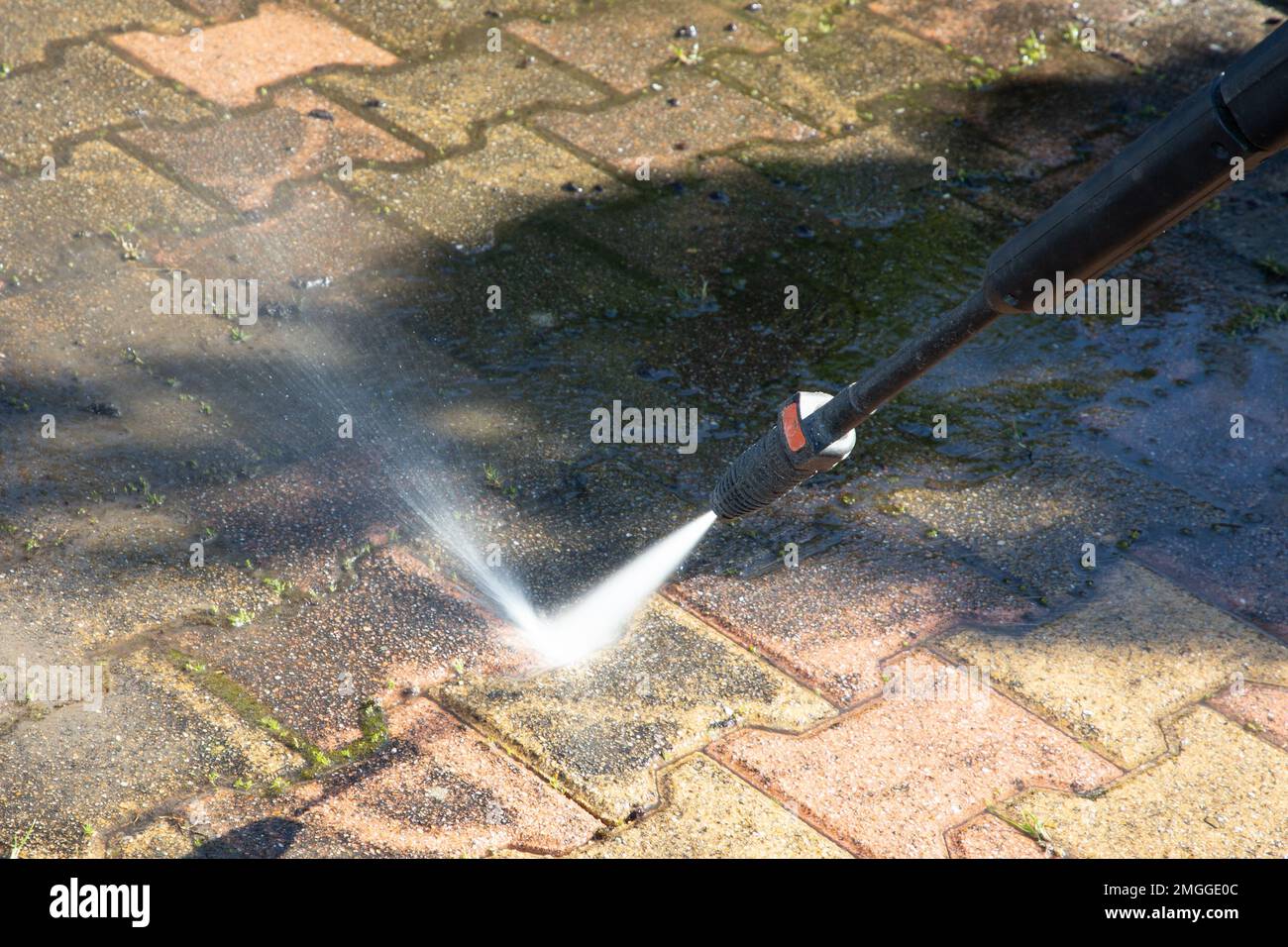 Outdoor floor cleaning with high pressure water jet Stock Photo - Alamy