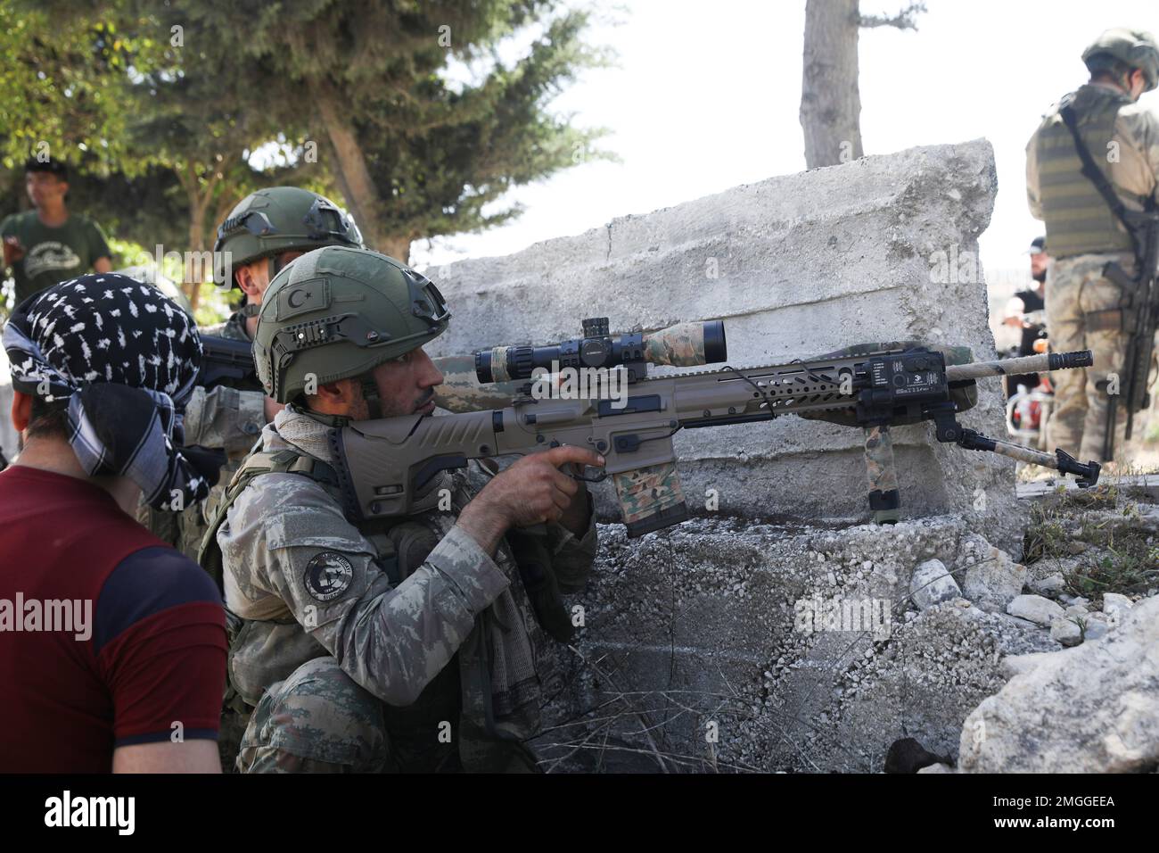 Turkish soldiers take cover after a nearby explosion outside the city ...