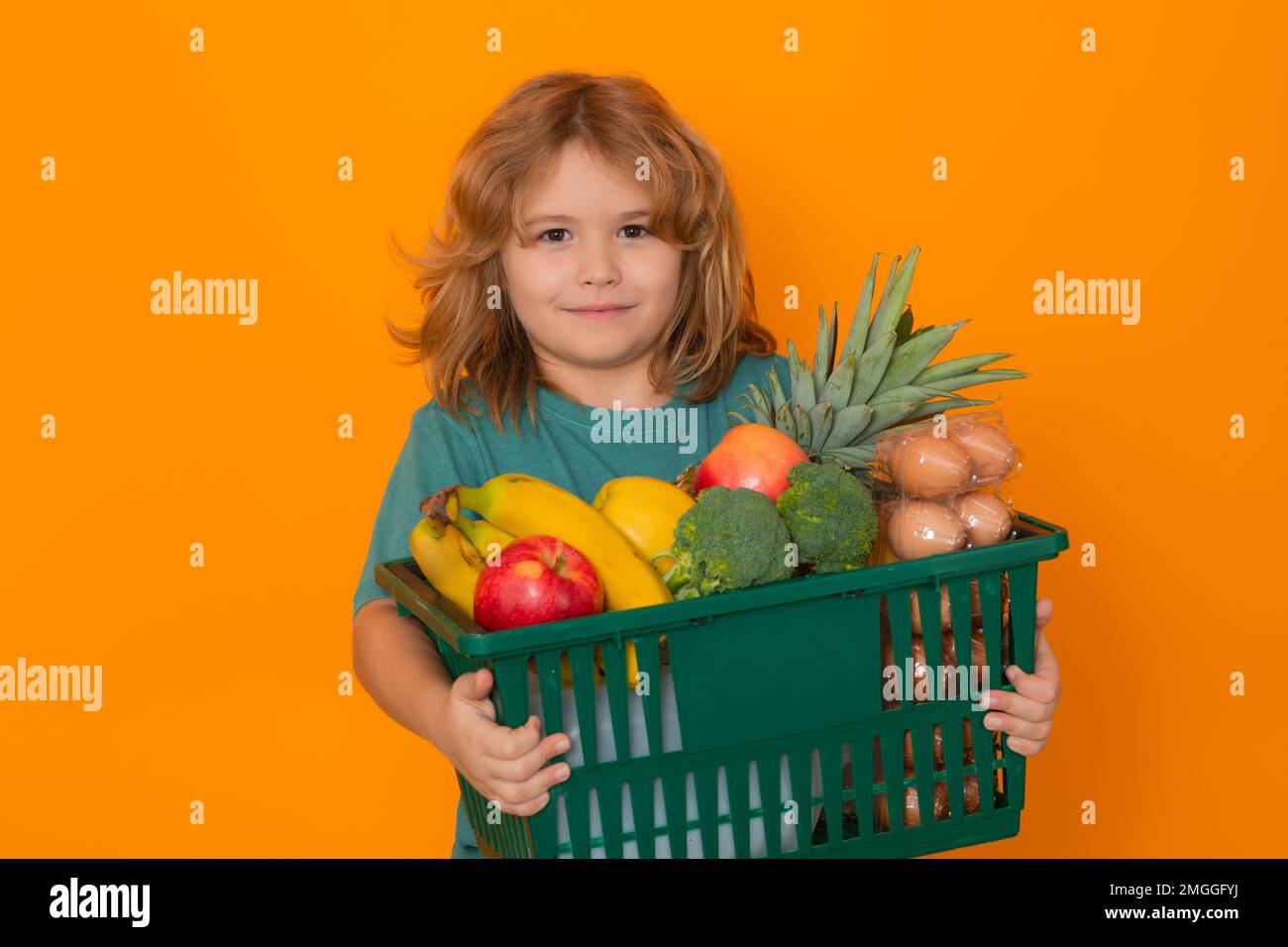 Food store. Kid at vegetable supermarket. Child with shopping basket ...