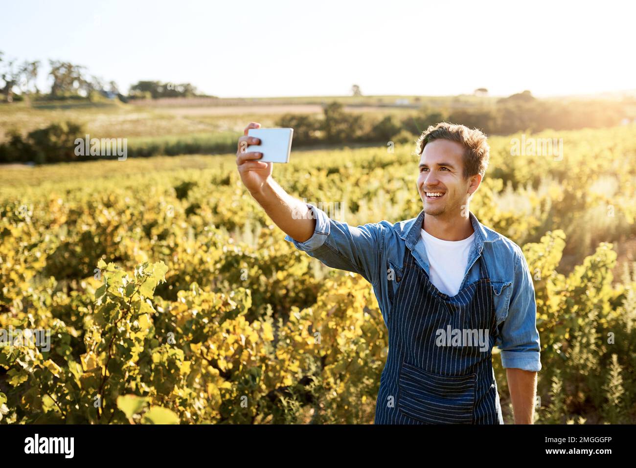 Seeking out new markets and opportunities. a young man taking a selfie ...