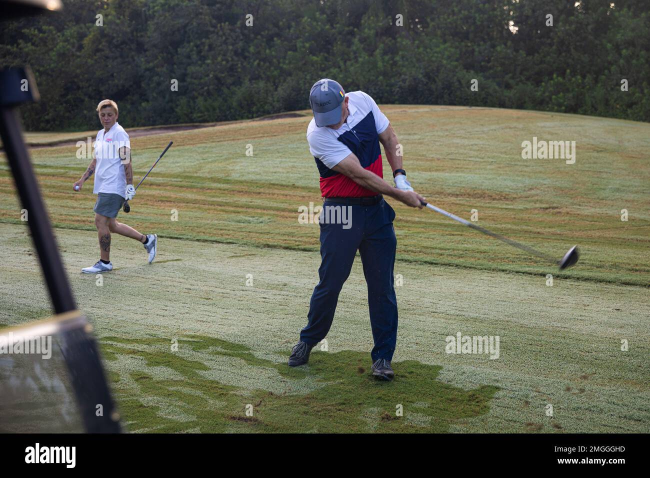 U.S. Army Staff Sgt. Stacey Englert, left, looks on while Commander, U ...