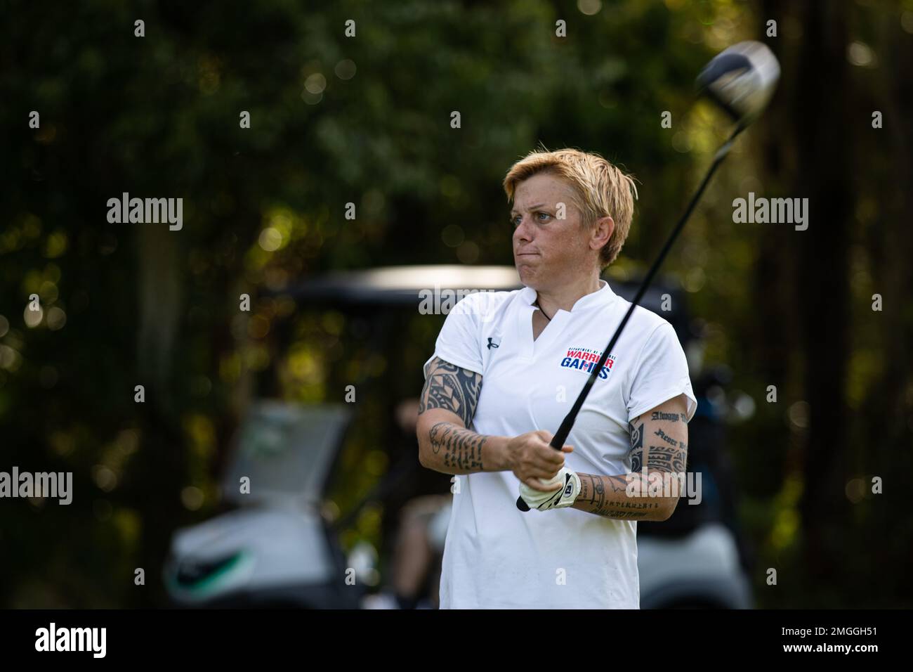U.S. Army Staff Sgt. Stacey Englert watches the flight of her ball ...