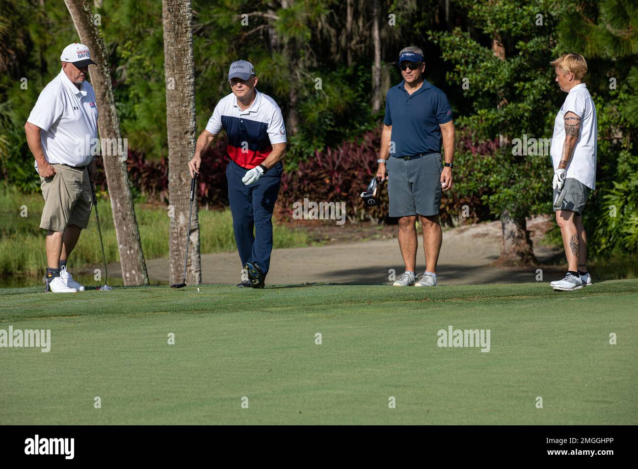 From left, Team Army golf coach Chris Uggiano, Commander, U.S. Army ...