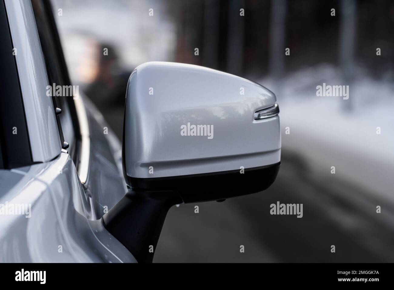 Side rear-view mirror on a modern car. Closeup photo of a car mirror ...