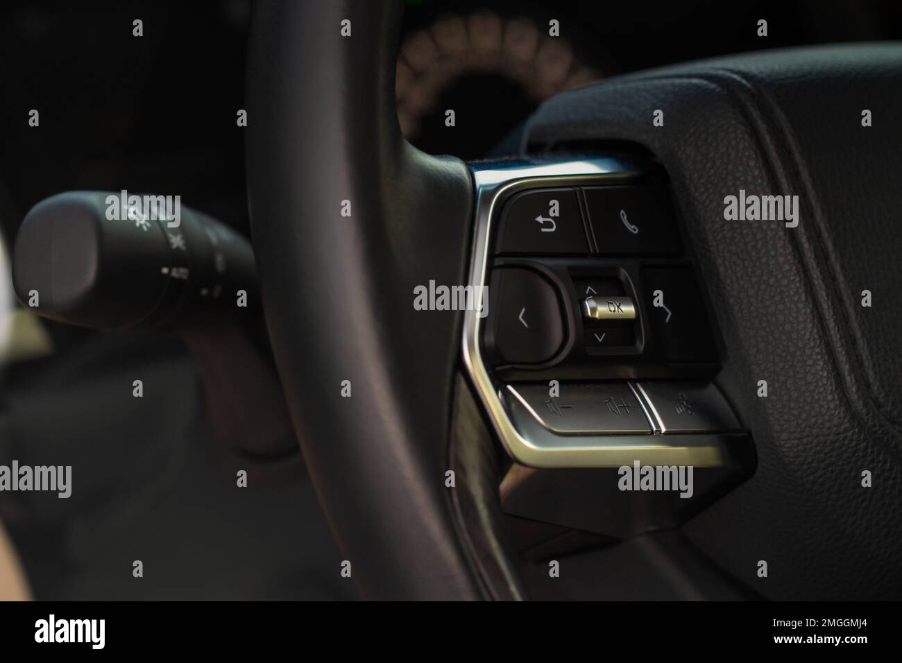 Volume and audio control buttons on the steering wheel. Car audio ...