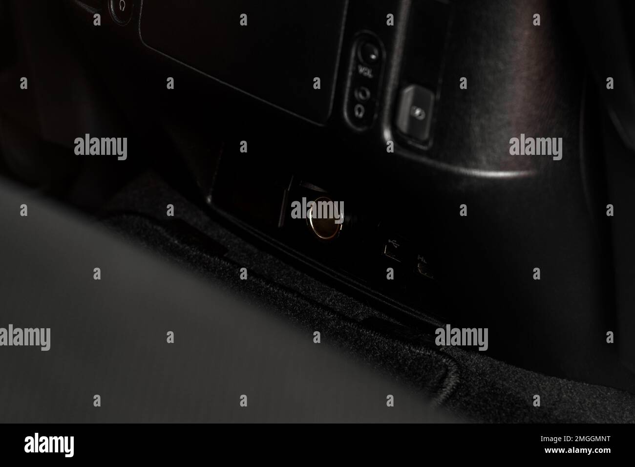 Modern car outlet socket. Opened 12V power outlet socket and closed USB ...