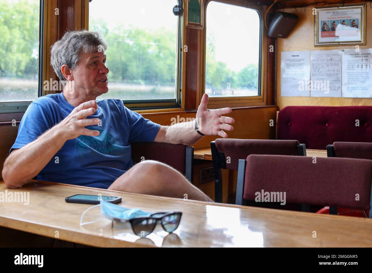 Danny Collier gestures as he sits in his boat, the Princess Freda on ...