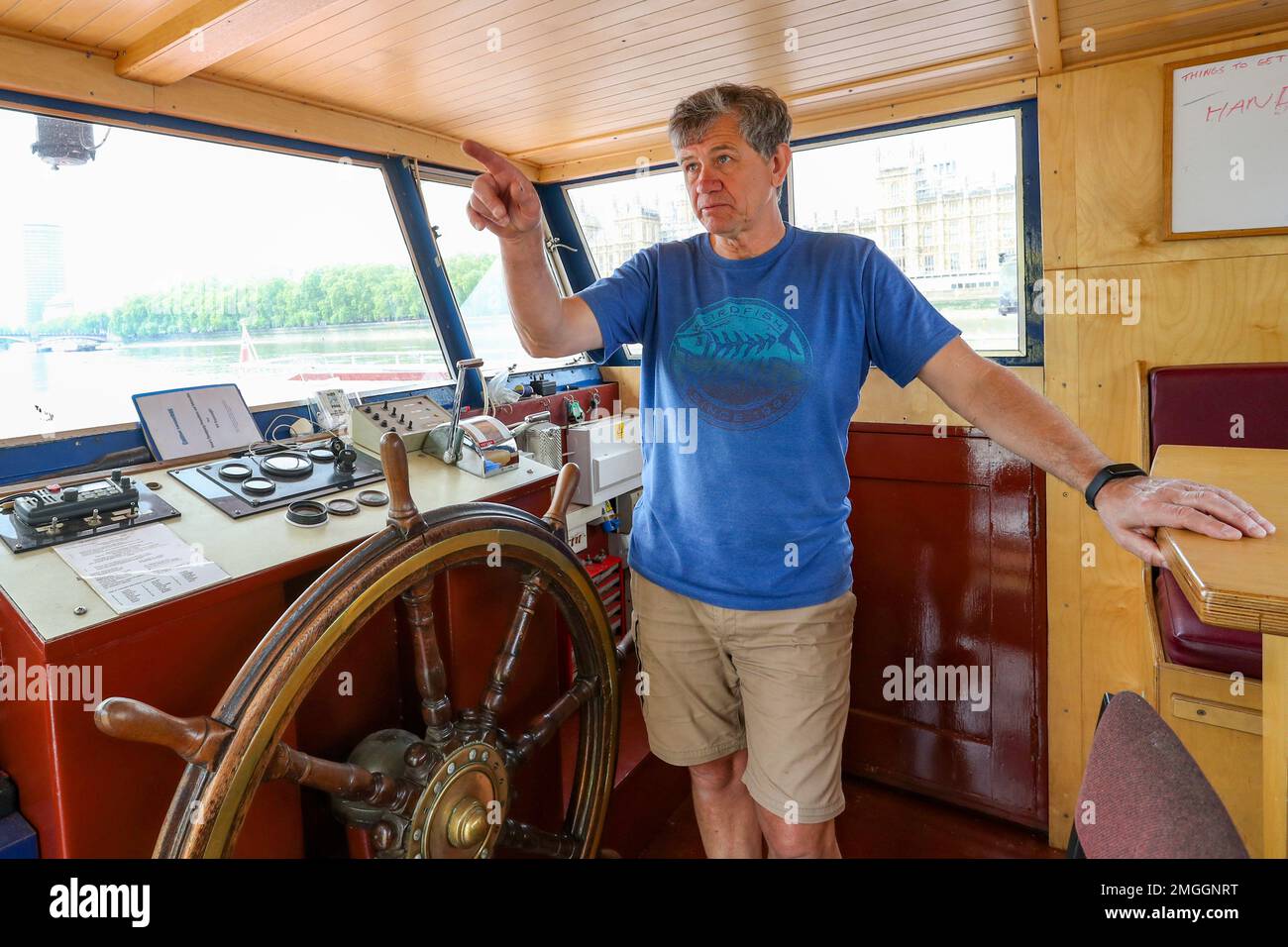 Danny Collier gestures as he speaks aboard his boat, the Princess Freda ...