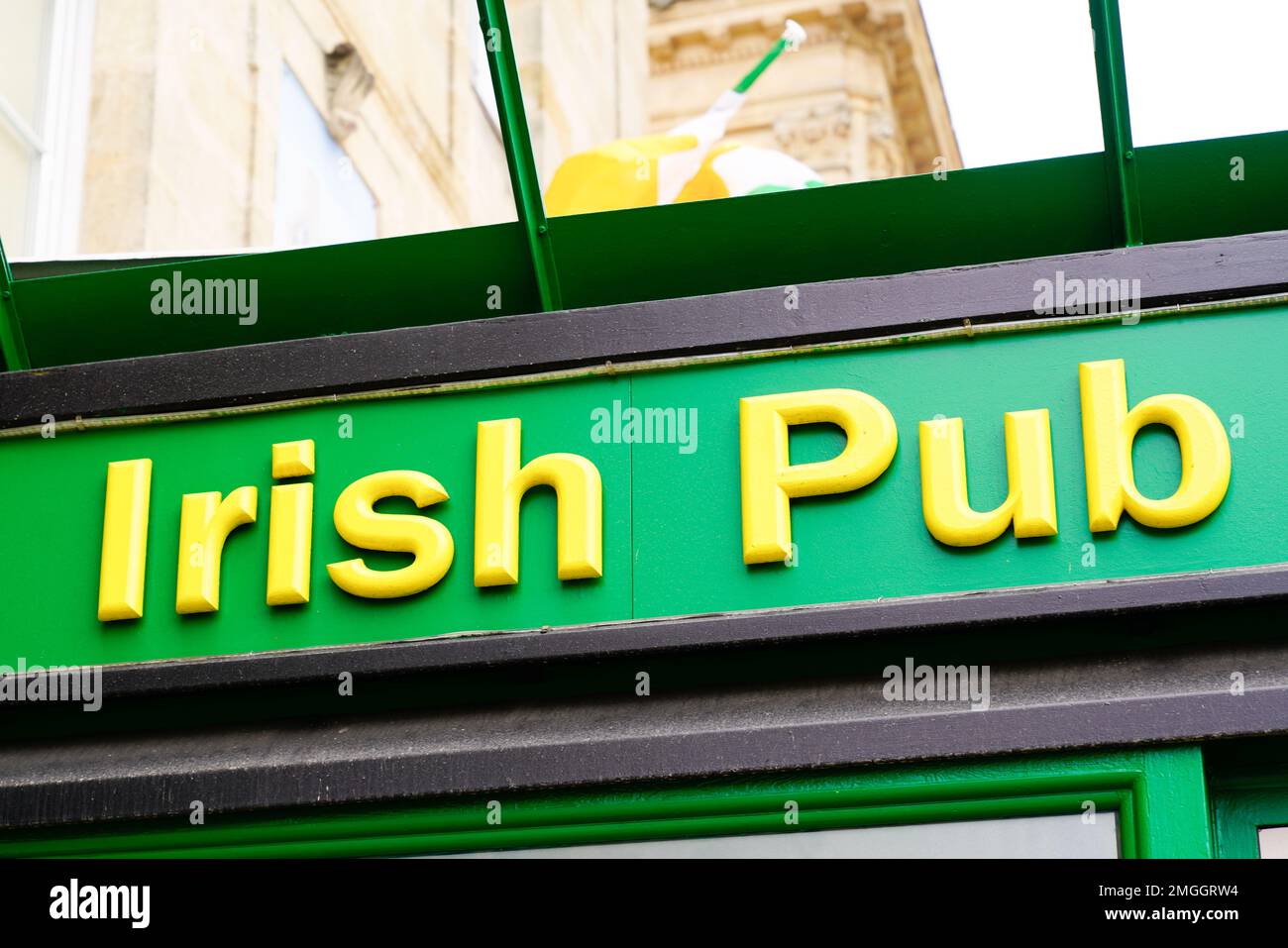 irish pub sign text on bar entrance in city europe street storefront ...