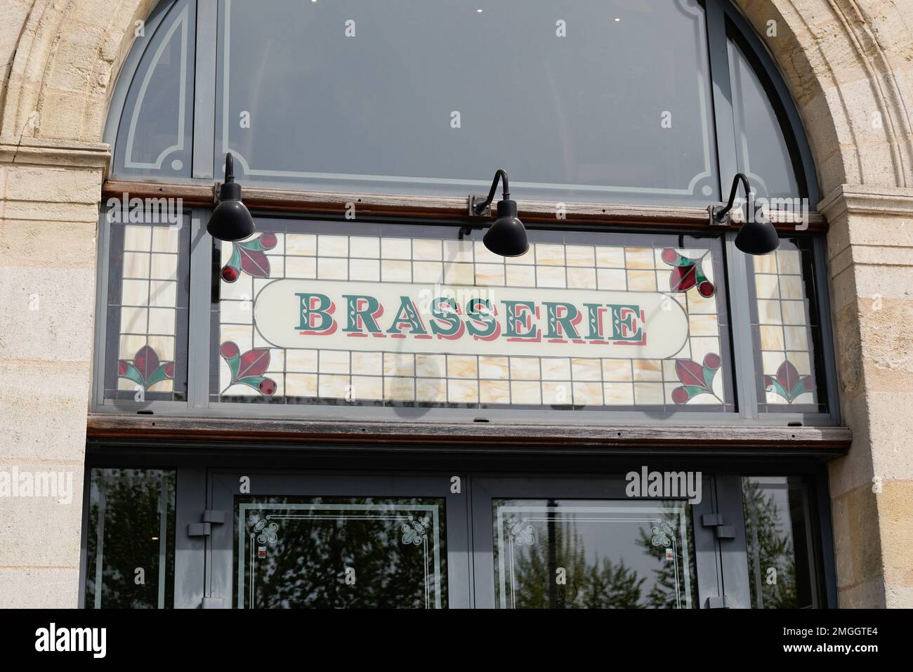 brasserie restaurant text sign paint on wall facade french building ...