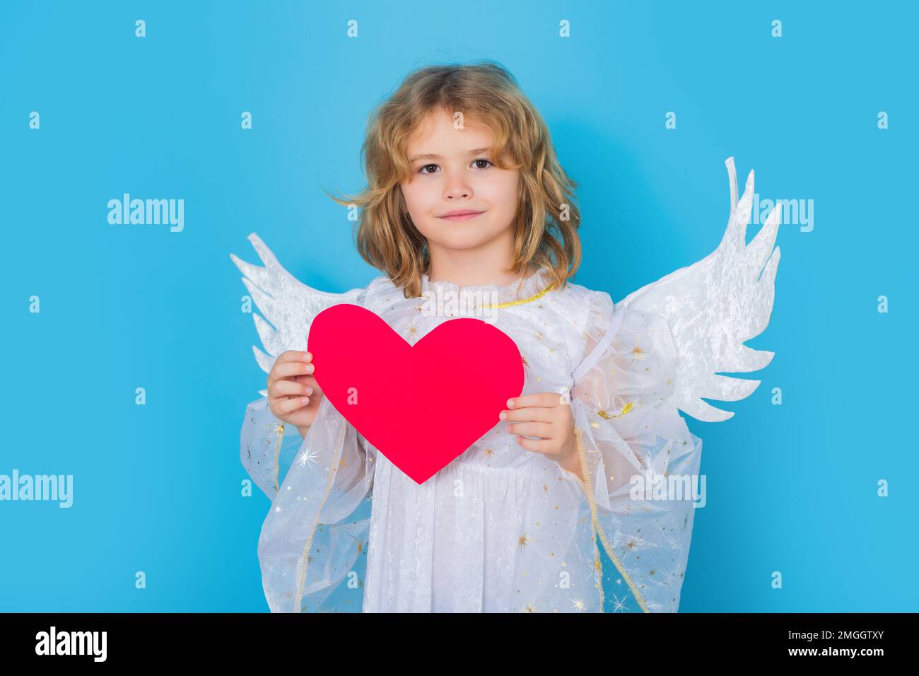 Angel kid with heart. Kid wearing angel costume white dress and feather ...