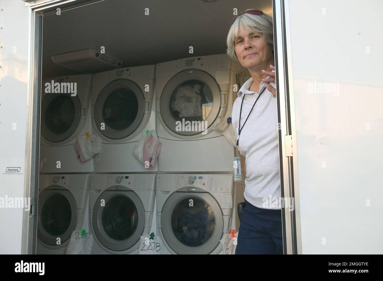 Base Camps - 26-HK-66-22. LA Plaquemines Camp--civilian in laundry ...