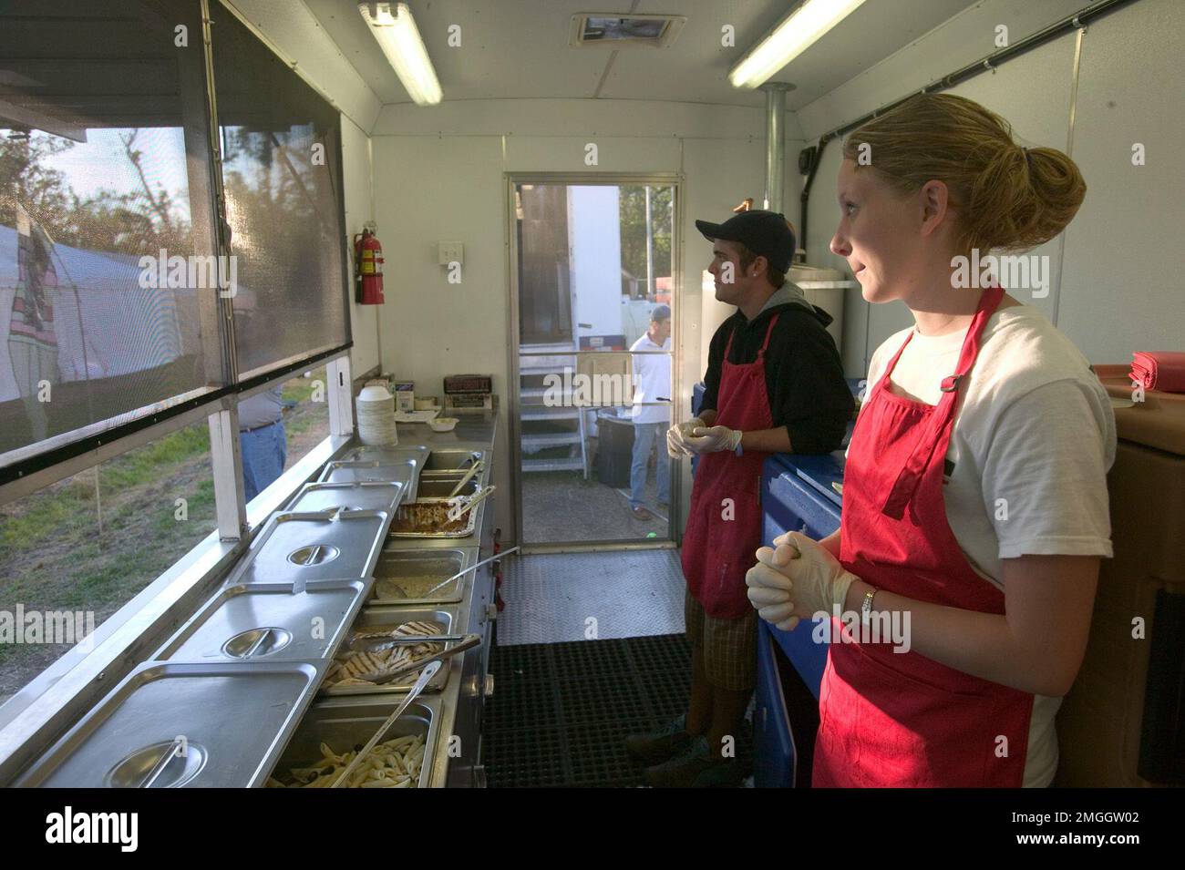 Base Camps - 26-HK-66-67. LA Plaquemines Camp--staff working in mess ...